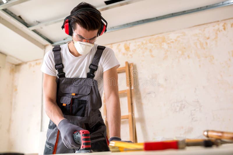 Hard Working Young Man Applying Finishing Touches Stock Image - Image ...