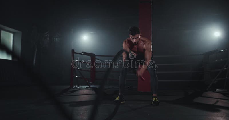 Hard Workout Time for a Bodybuilding Man Using Ropes To Doing Hard ...