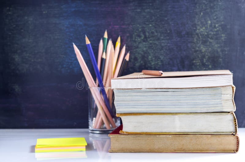 Hardback and Textbook Stacked with Pencils on the Table on the B Stock ...