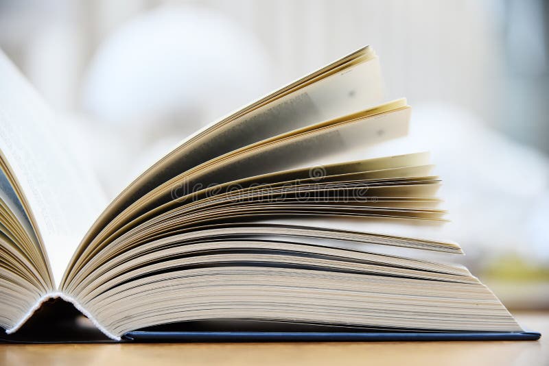 Hardcover Book Lying on the Table in a Library Stock Photo - Image of ...