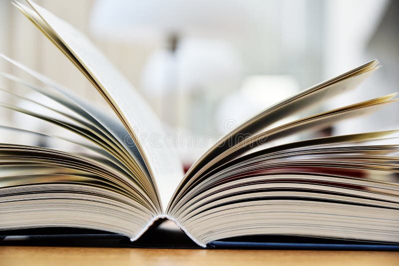 Hardcover Book Lying on the Table in the Library Stock Image - Image of ...