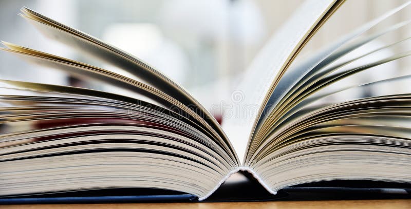Hardcover Book Lying on the Table in the Library Stock Image - Image of ...