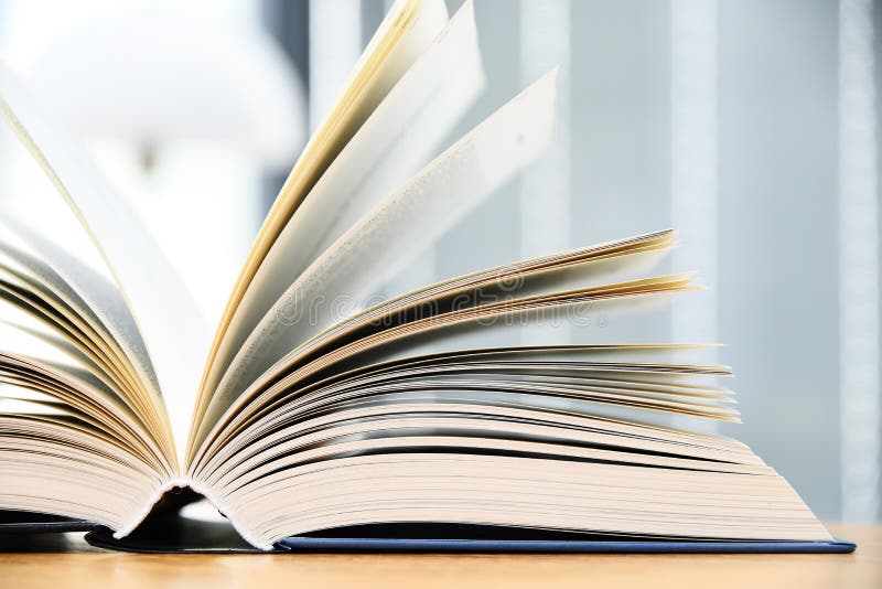 Hardcover Book Lying on the Table in the Library Stock Photo - Image of ...