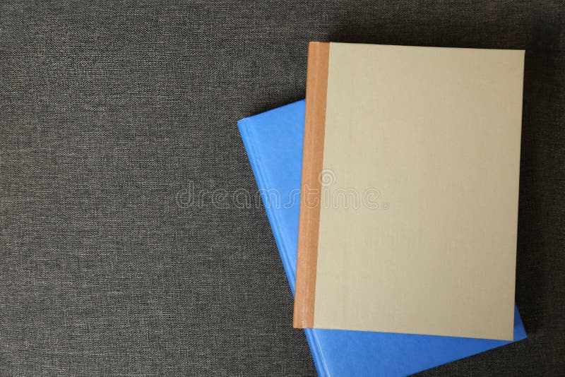 Hardcover Books on Grey Fabric, Top View. Space for Text Stock Image ...