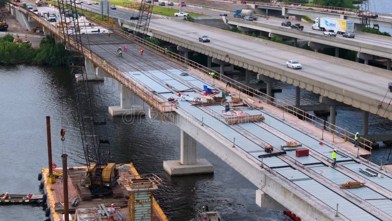 Hardhat Workers at Highway Bridge Construction. Development of Tbridge ...