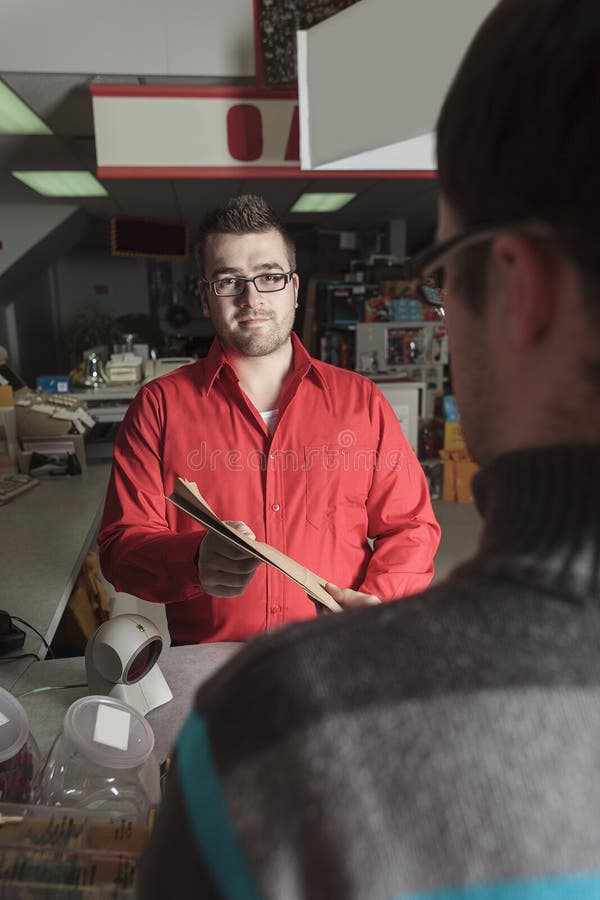 Hardware store employee stock image. Image of megastore - 50822445