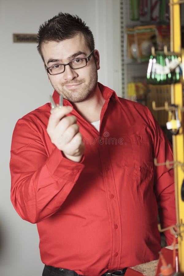 Hardware store employee stock image. Image of retail - 50822461