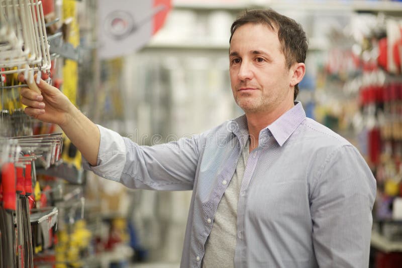 Hardware store stock image. Image of male, crossed, orange - 71863091