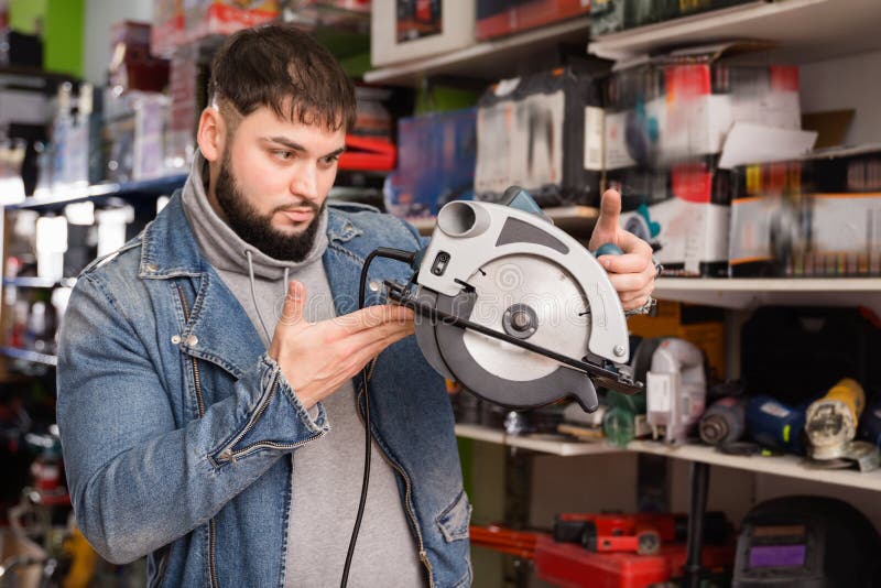 Hardware Store Visitor Chooses Circular Saw in Tool Store Stock Photo ...