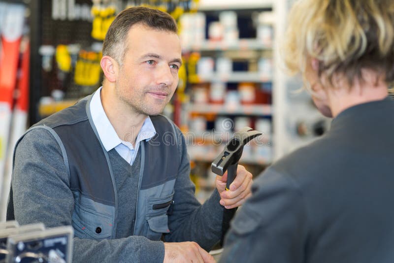 Hardware Worker Assisting Customer Stock Photo - Image of workshop ...