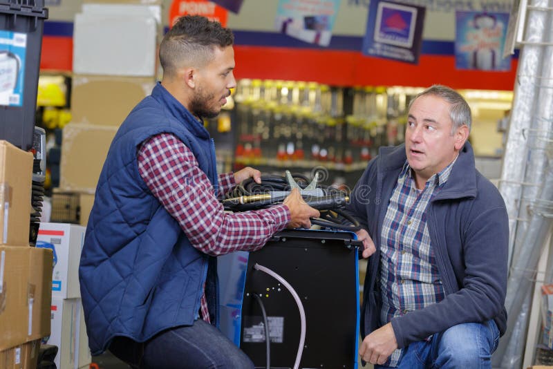 Hardwarer Store Worker Talking Stock Image - Image of cheerful, paint ...
