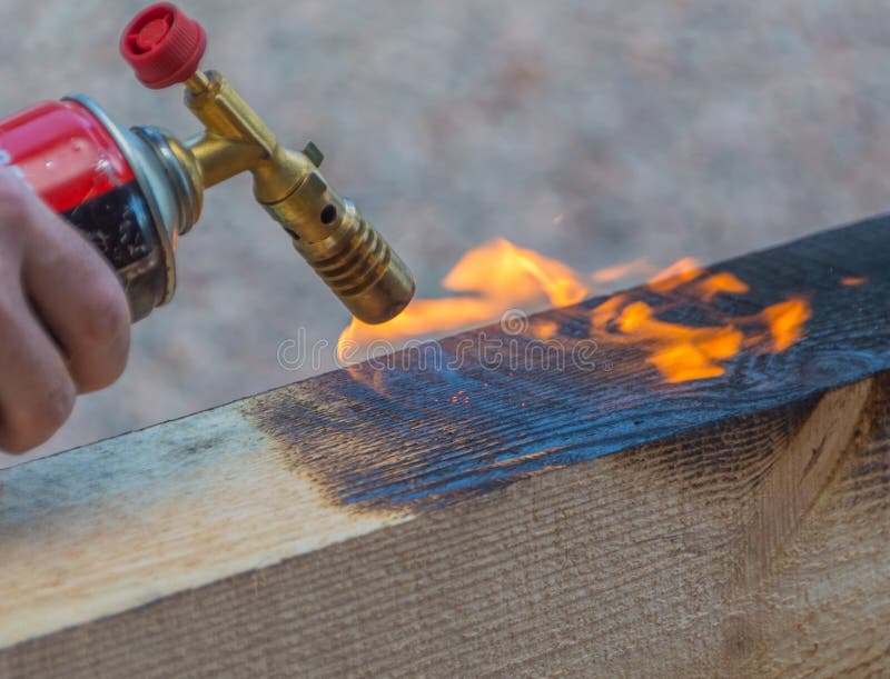 Hardwood Timber is Treated with Fire from a Gas Burner. Stock Image ...
