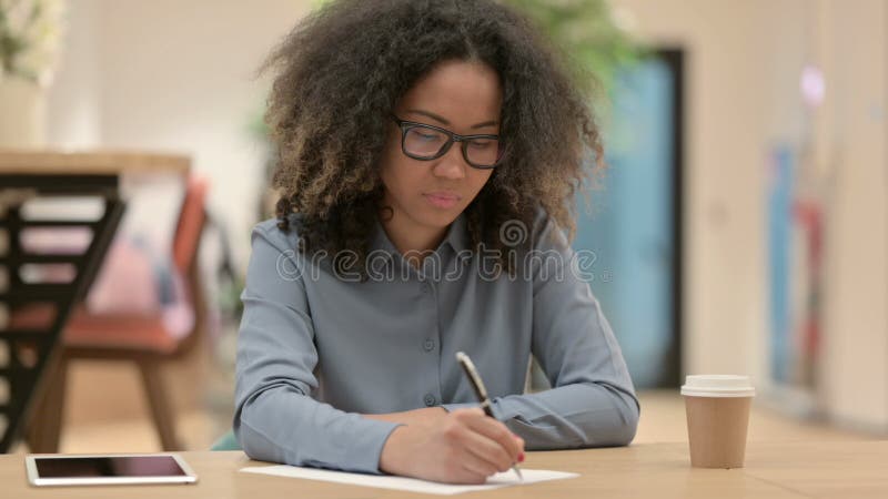 Hardworking Young African Woman and Writing on Paper Stock Video ...