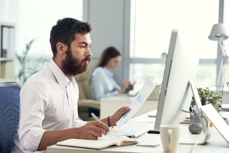 Hardworking Bearded Man with Papers at Table Stock Photo - Image of ...