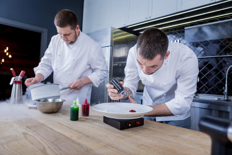 Hardworking Cooks Preparing a Lot of Different Dishes Stock Image ...