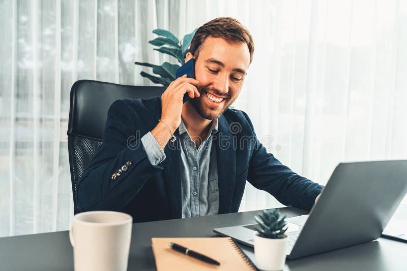 Hardworking and Diligent Businessman Working on His Laptop and Phone ...