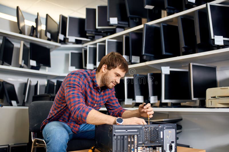 Hardworking Guy Fixes Technical Problems with the Computer Stock Photo ...