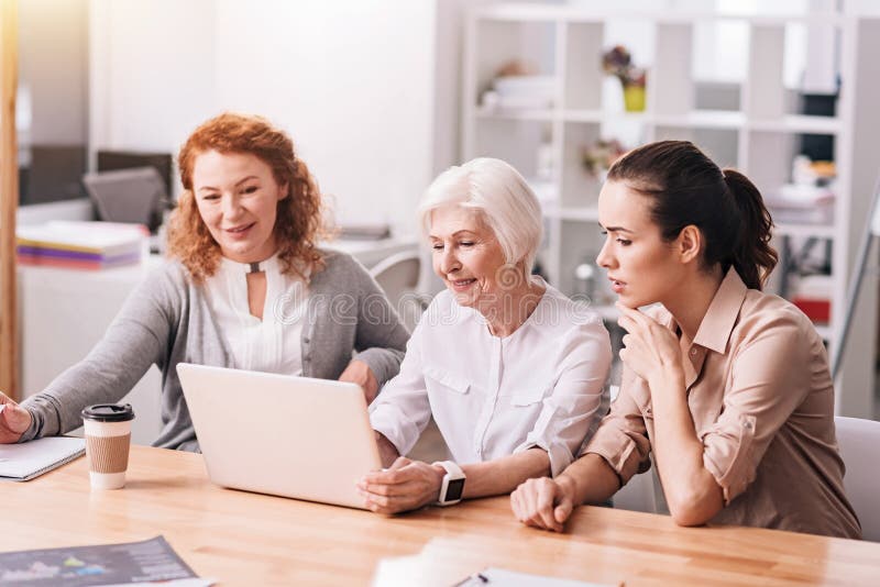 Hardworking Involved Colleagues Collaborating in the Office Stock Photo ...