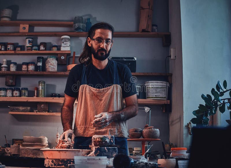 Portrait of Hardworking Man with Clay at His Own Studio. Stock Photo ...