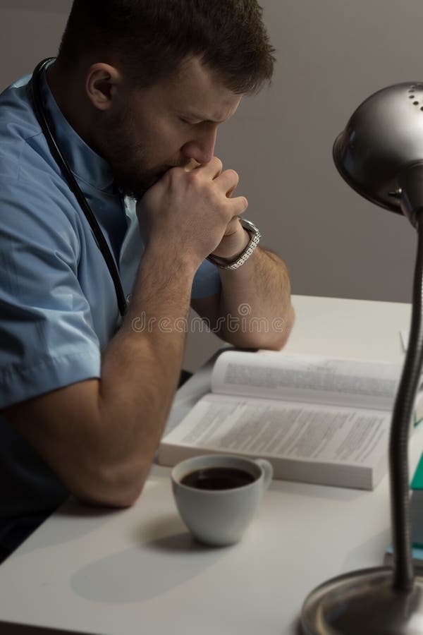 Hardworking Surgeon Sitting at Desk Stock Image - Image of professional ...