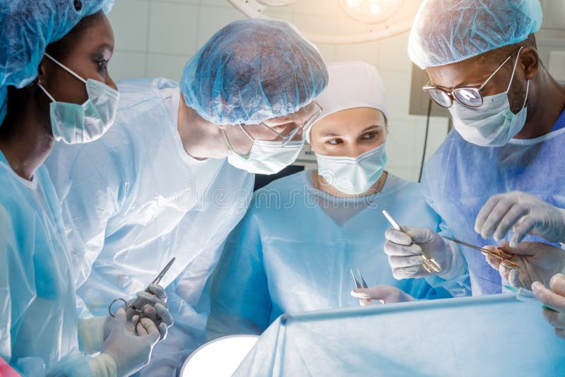 Hardworking Team of Surgeons at Work in Operating Room. Stock Image ...