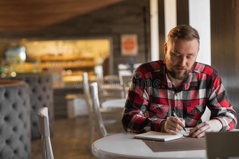 Hardworking White Man Writing Down Info at Notepad, Getting Ready for ...