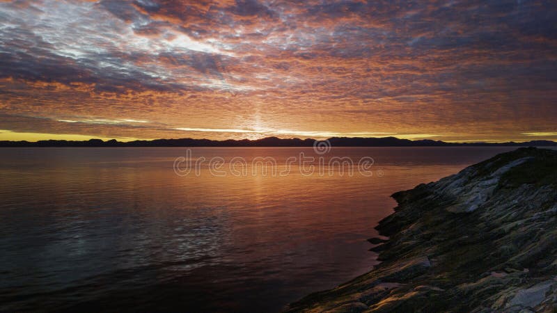 Harmony of Fire: Sunset Over the Sea of ??Nuuk Stock Photo - Image of ...