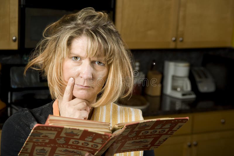 Harried Woman with Recipe Book Stock Image - Image of frustrated ...