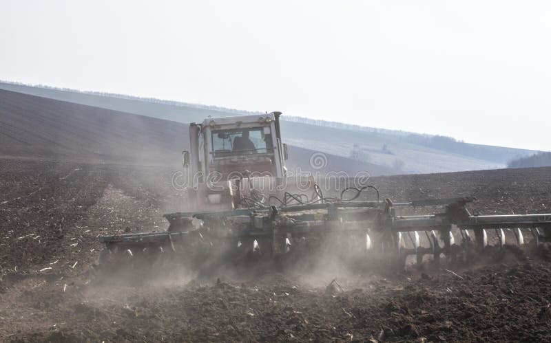 Harrowing the Soil with Disc Harrows Stock Image - Image of humus ...