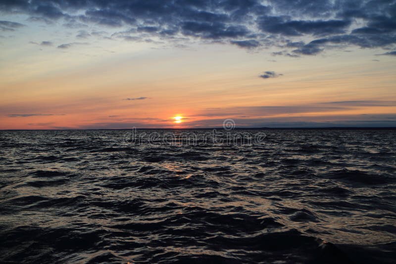 Harsh Sea in the Evening at Sunset Stock Photo - Image of setting ...