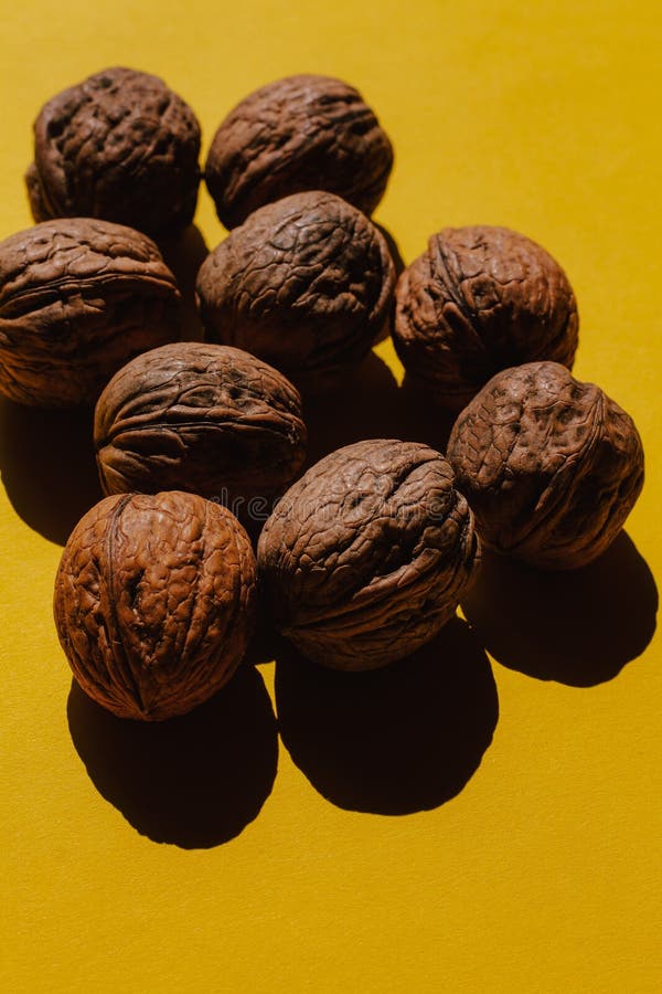 Harvested Nuts on Yellow Background, Concept of Nuts and Food ...