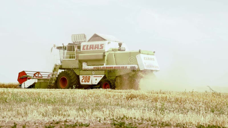 Harvester in the Field. Wheat Harvesting Process Stock Video - Video of ...