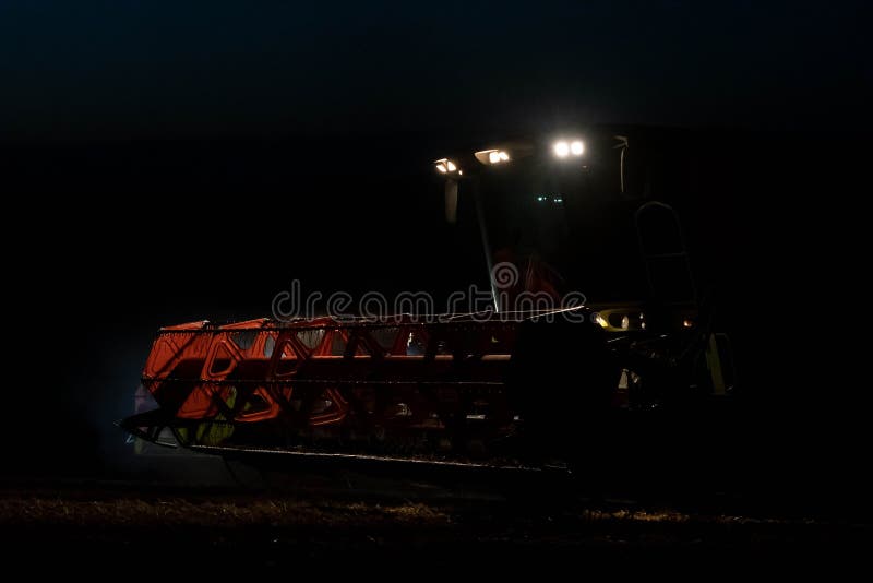 Harvester at Work on Field at Night Stock Image - Image of combine ...