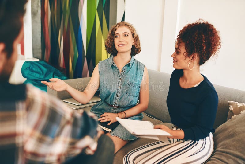 She Has All the Bright Ideas. a Group of Designers Having a Discussion ...