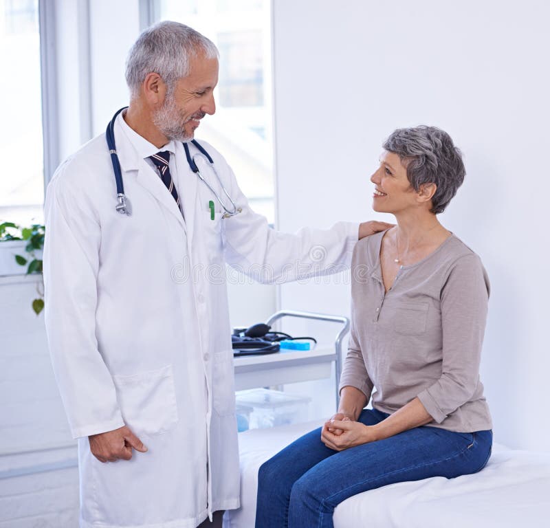 He Has a Great Bedside Manner. a Doctor Reassuring a Patient. Stock ...