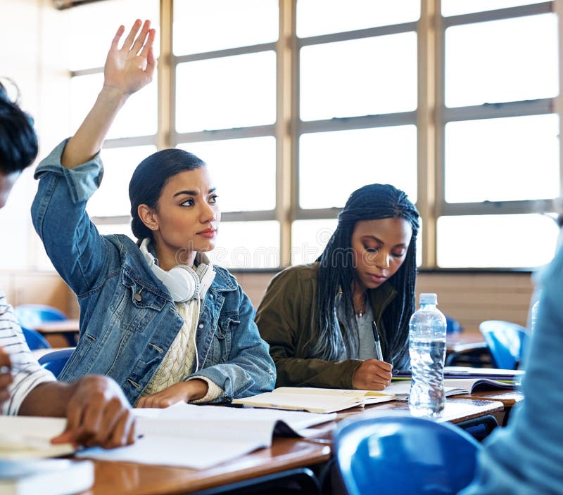 She Has a Question. an Attractive Young University Student Sitting in ...