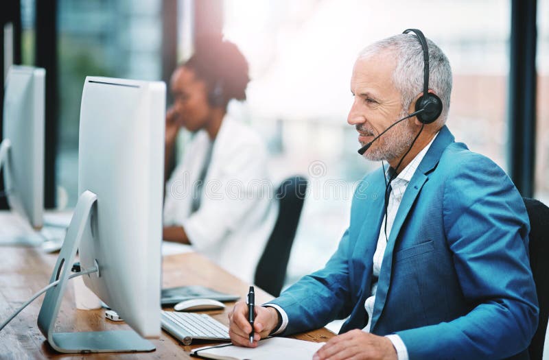 He Has Years of Experience. a Handsome Mature Male Operator Working at ...