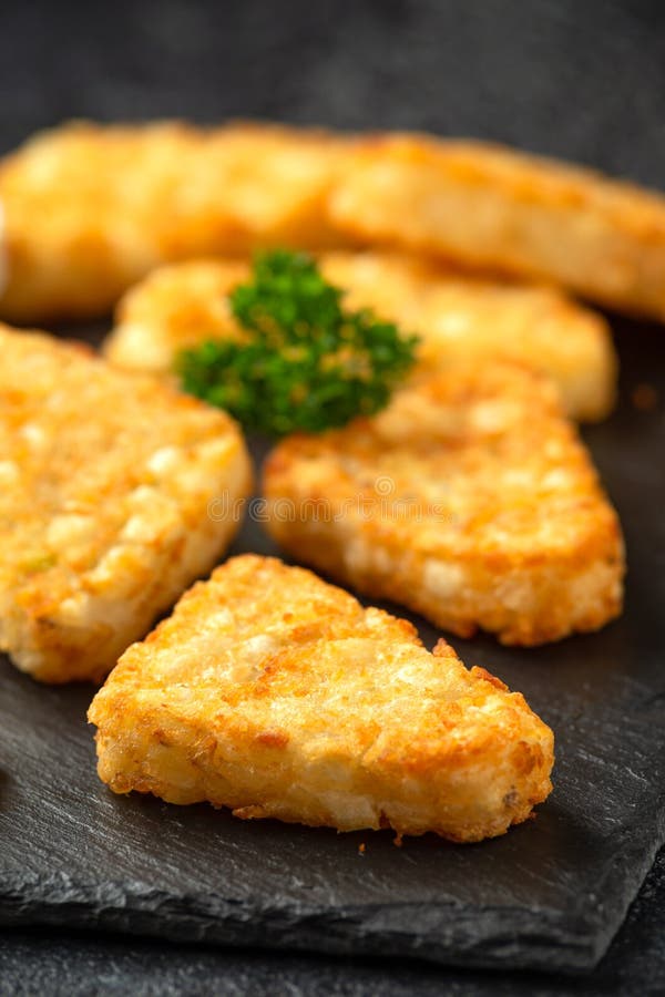 Hash Brown Potato Patties on Rustic Stone Board Stock Photo - Image of ...