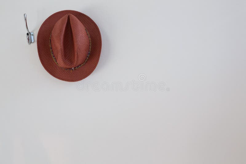 Hat hanging on hook stock photo. Image of copy, space - 103002768