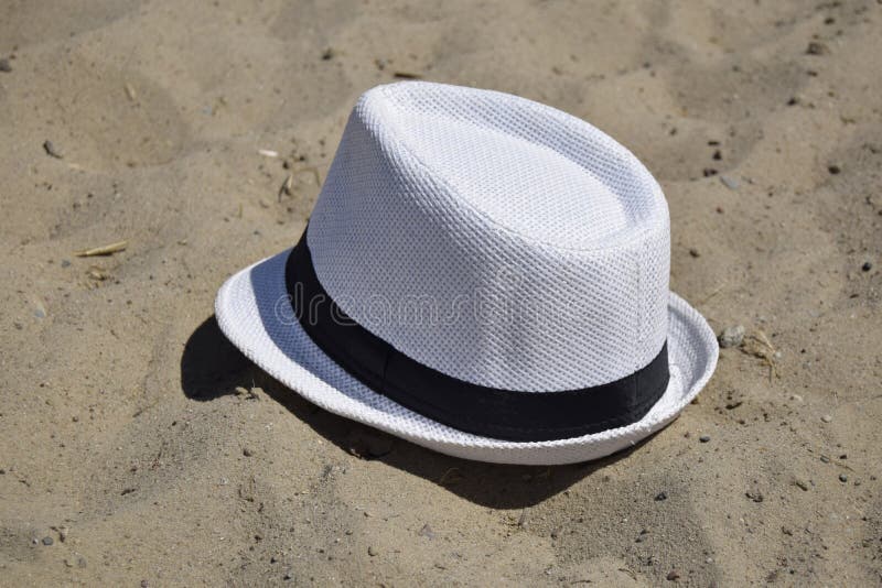 The Hat Men`s White is on Sand. Stock Photo - Image of nature, mens ...