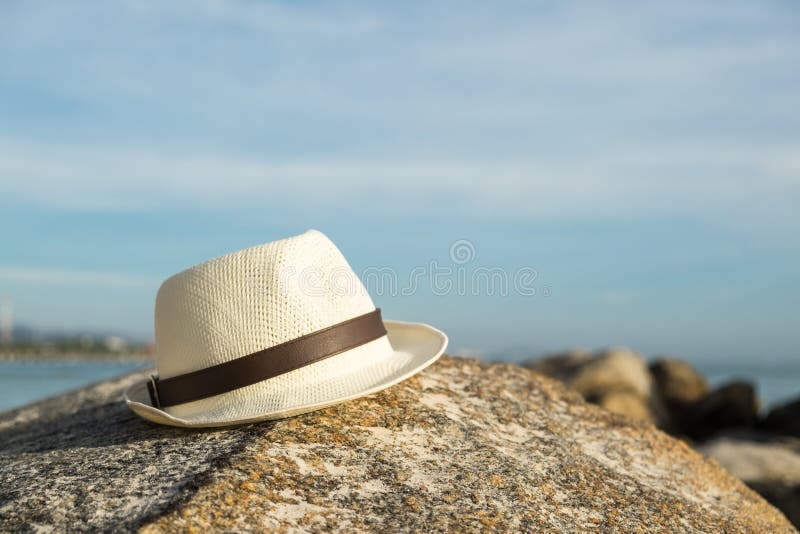 Hat on the Rock at the Beach Stock Photo - Image of blue, sand: 68139432