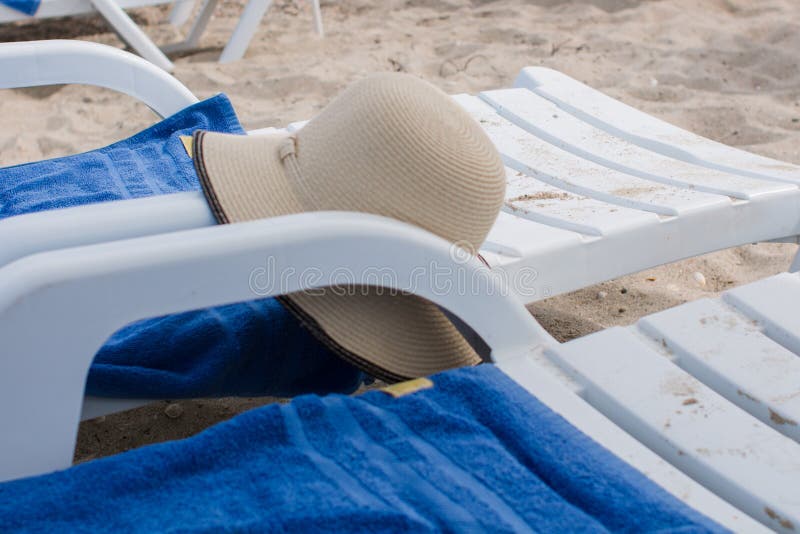 Hat on a Sun Lounger on the Beach Stock Photo - Image of nature, sand ...