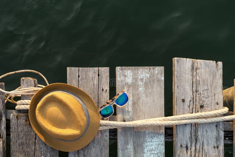Hat and Sunglasses on Wooden Bridge Stock Photo - Image of coast, beach ...