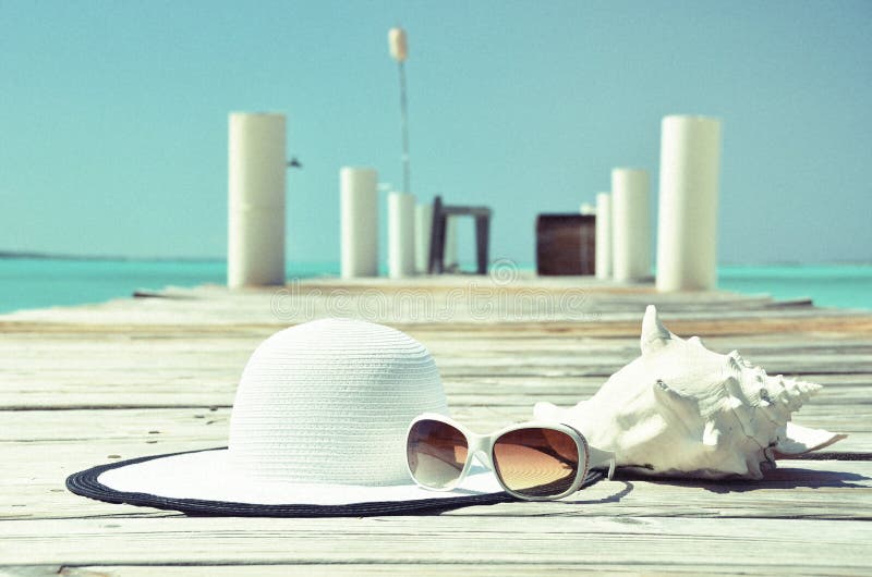 Hat and sunglasses stock image. Image of outdoor, table - 49365897