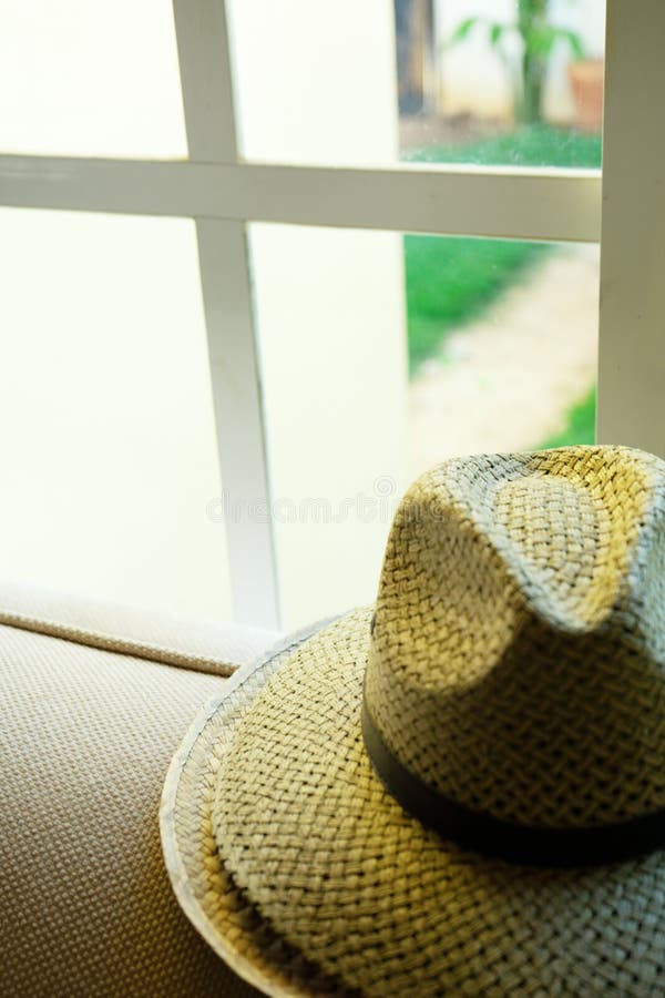 Hat at the window stock photo. Image of comfortable - 175969824