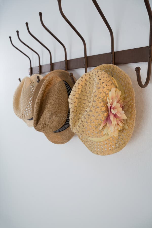 Hats hanging on hook stock photo. Image of white, variety - 103802216