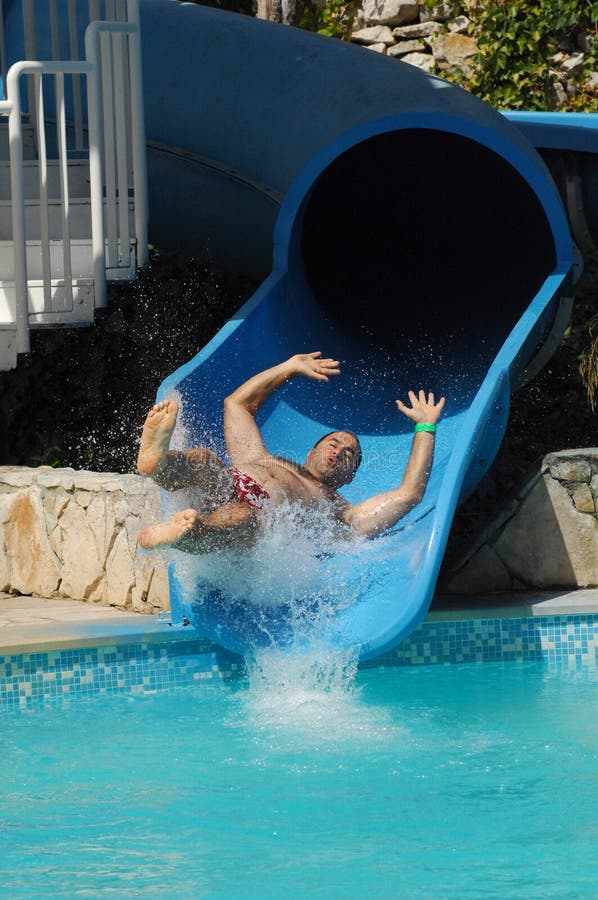 Aqua Park Fun - Man Enjoying a Water Tube Ride Stock Photo - Image of ...
