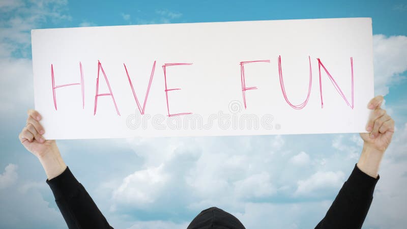HAVE FUN Text on a Placard Against Blue Sky Stock Image - Image of ...