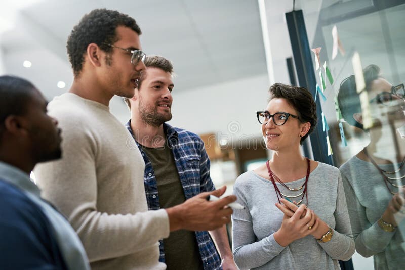 We Have To Plan Together To Plan Better. Shot of a Group of Designers ...