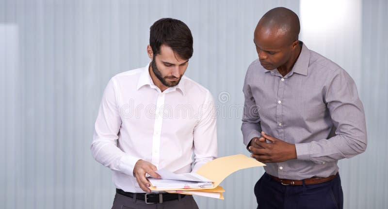 Have You Got a Second. Two Businessmen Discussing a File. Stock Image ...